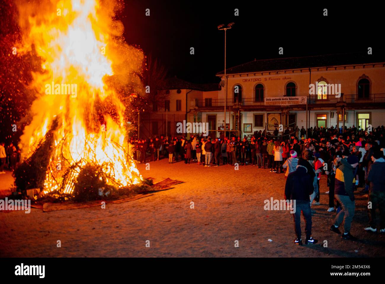 Serina Italy December 24 2022: People with torches walking towards the ...
