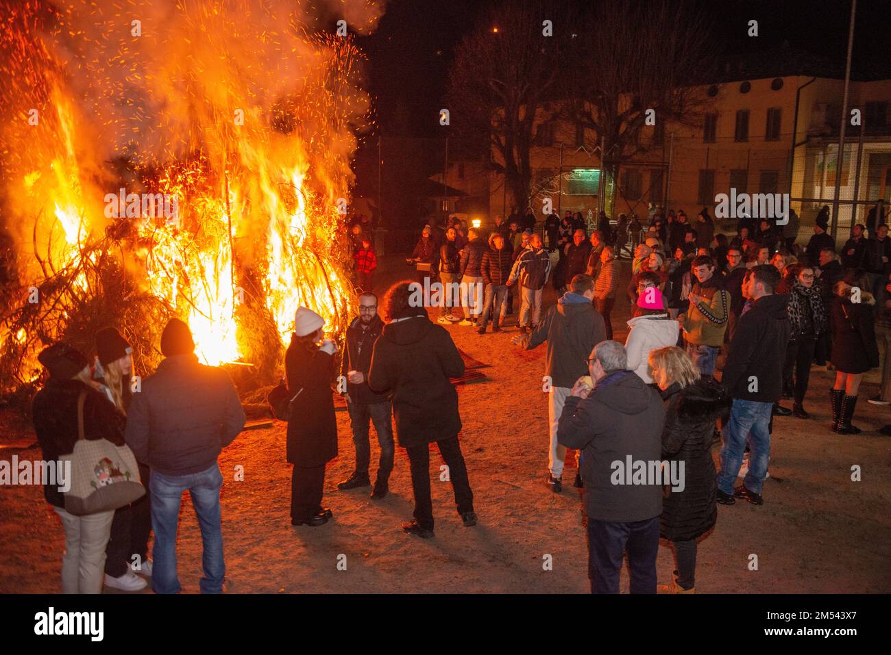 Serina Italy December 24 2022: People with torches walking towards the ...