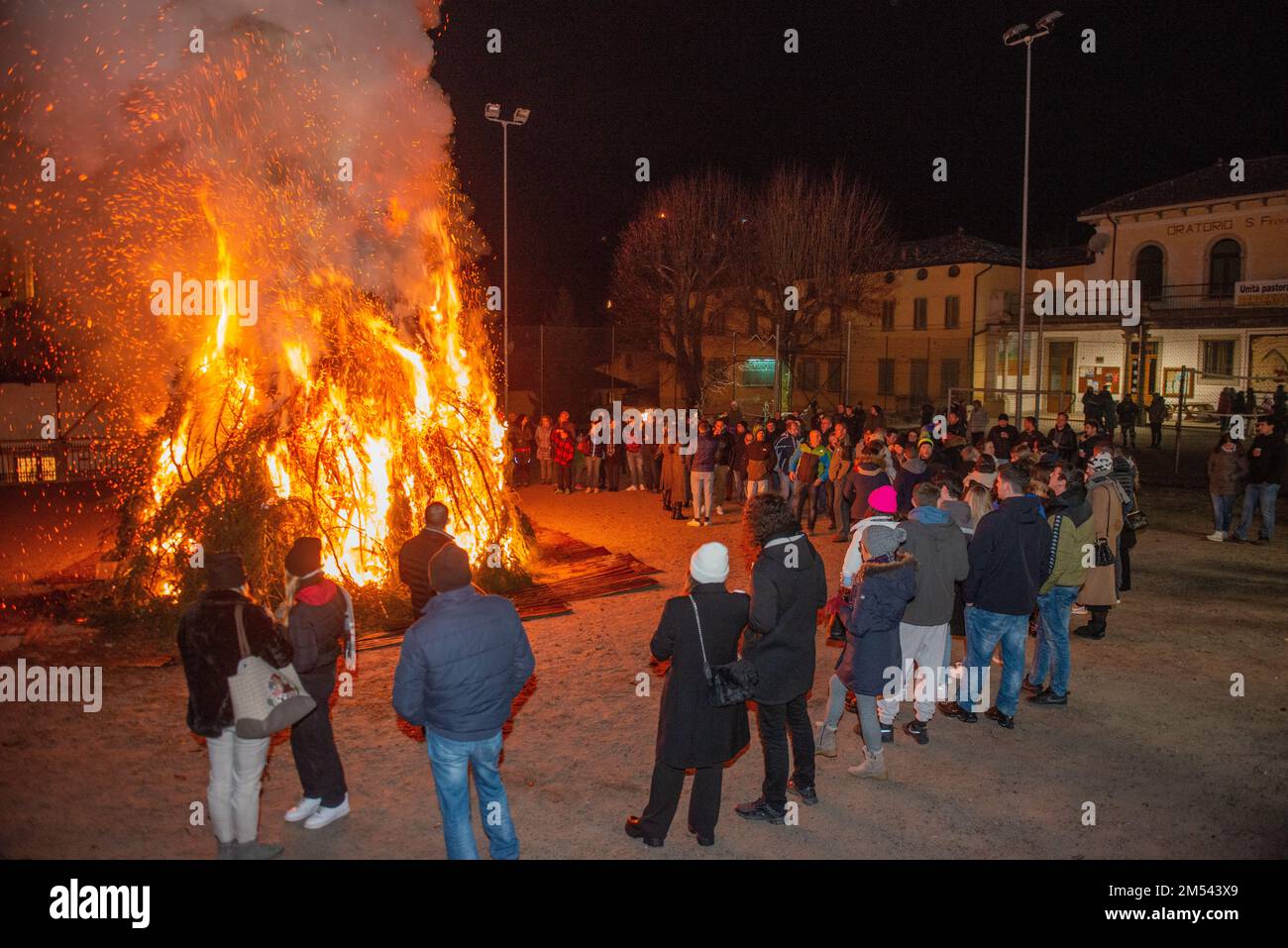 Serina Italy December 24 2022: People with torches walking towards the ...