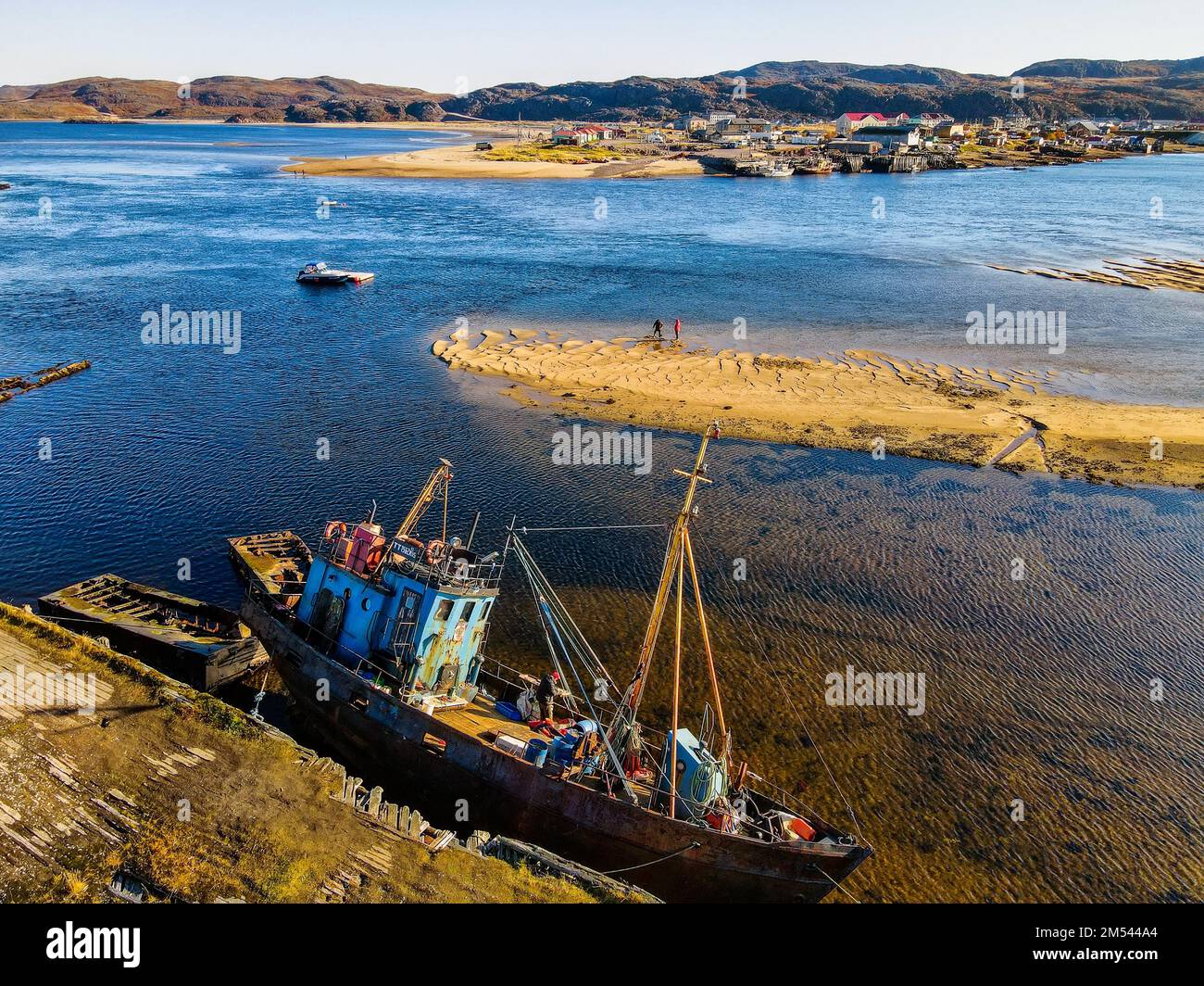 Abandoned fishing boat on the coast of the Barents Sea in Teriberka ...