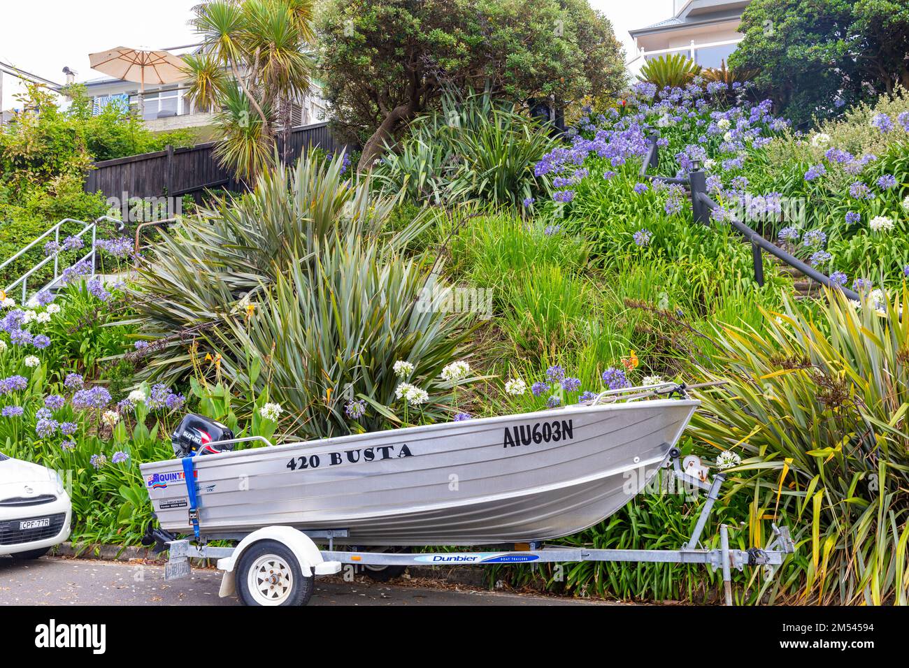 Australian made Quintrex tinnier dinghy boat parked on a trailer in a ...