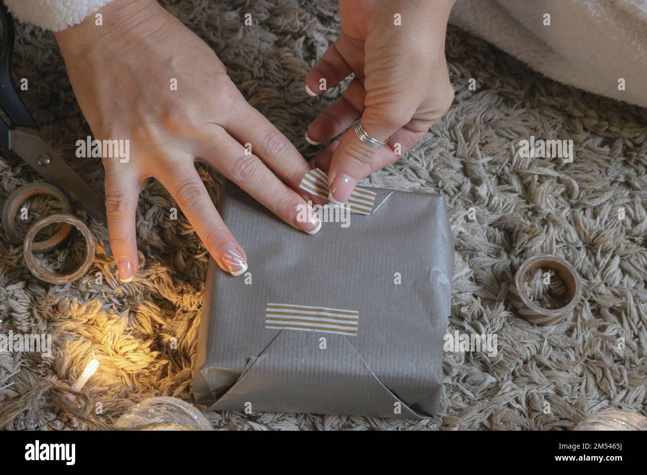 Wrapping a gift Stock Photo - Alamy