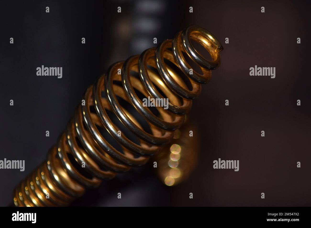 A close up of a coil metal handle on a woodstove door Stock Photo - Alamy