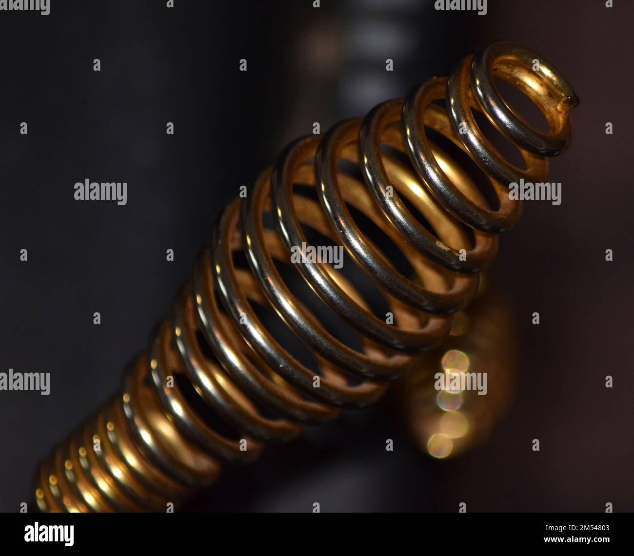 A close up of a coil metal handle on a woodstove door Stock Photo - Alamy