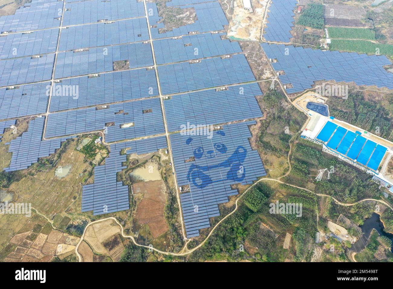 Aerial photo shows a photovoltaic power station with the giant panda ...