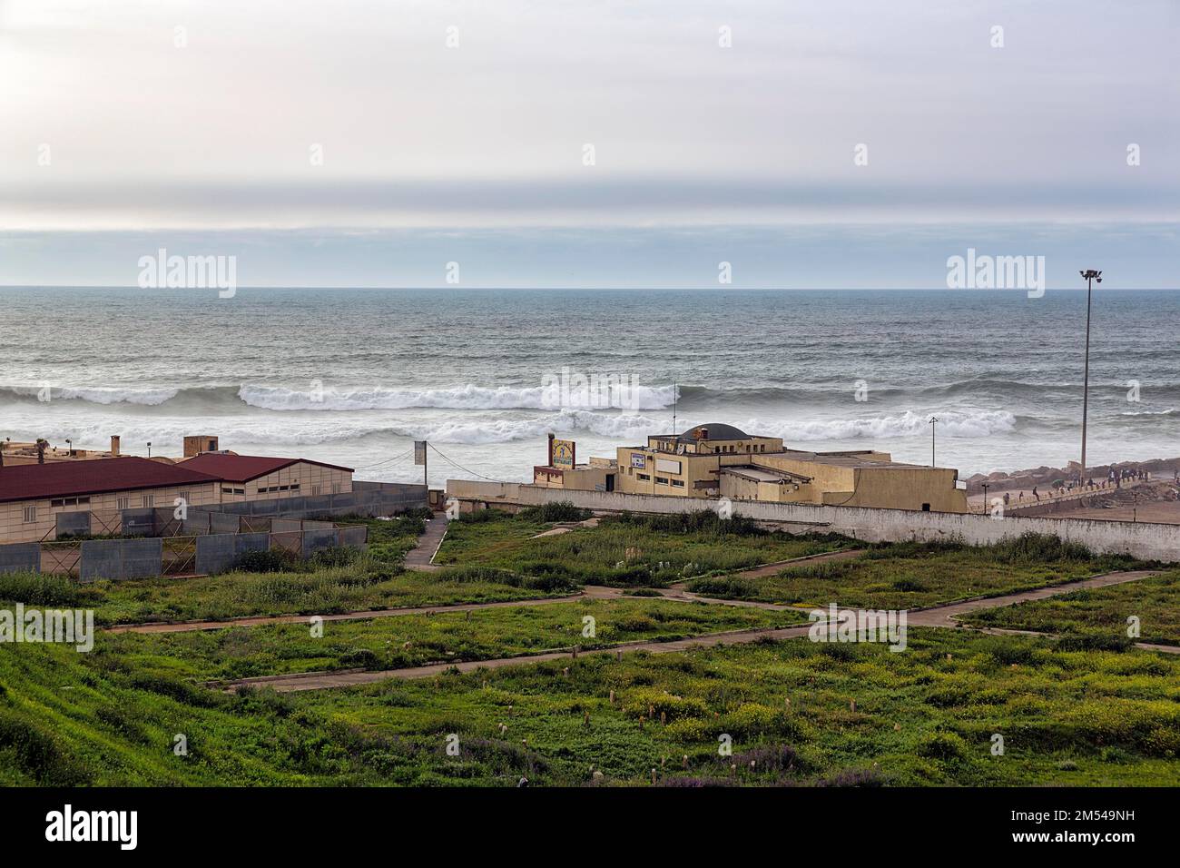 Restaurant and Muslim cemetery by the sea, view from above, Rabat ...
