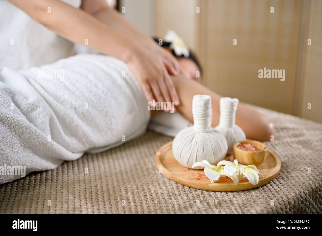 Thai spa concept, Spa herbal balls or massage stamps and spa salt on ...