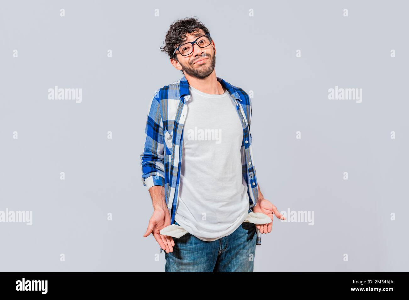 Sad man with no money showing his empty pockets, Unemployed people ...