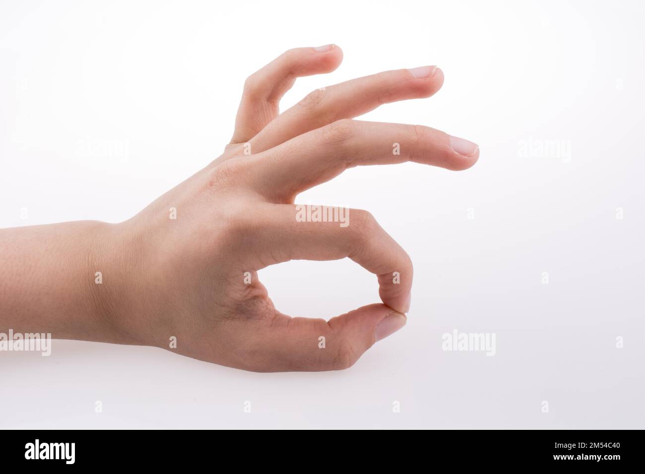 Hand making 'good' symbol on a whitebackground Stock Photo - Alamy
