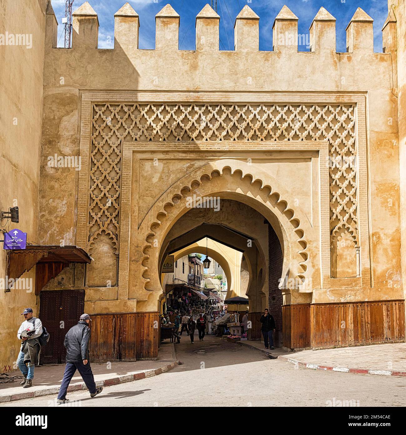 Monumental city gate with ornaments, passers-by at Bab Semmarine ...
