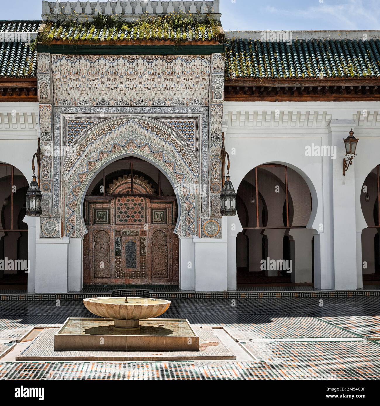 Inner courtyard with fountain and gate, Moroccan arches, arabesque ...