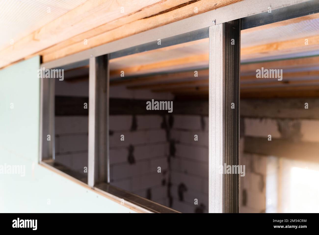 Stiffening ribs in a metal profile frame in a plasterboard wall close ...