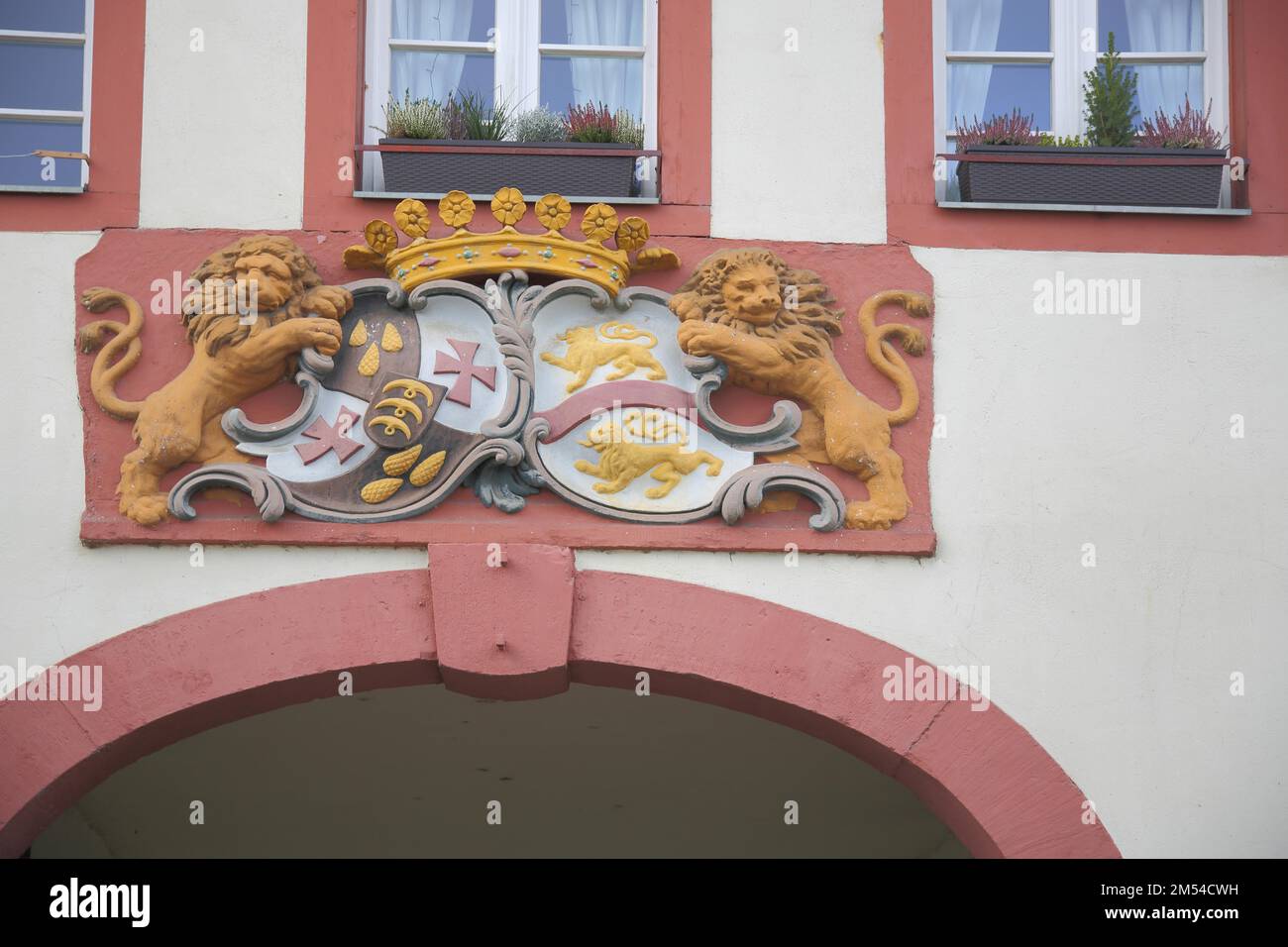 Entrance to Alter Adelshof with coat of arms, crown and lion figures ...