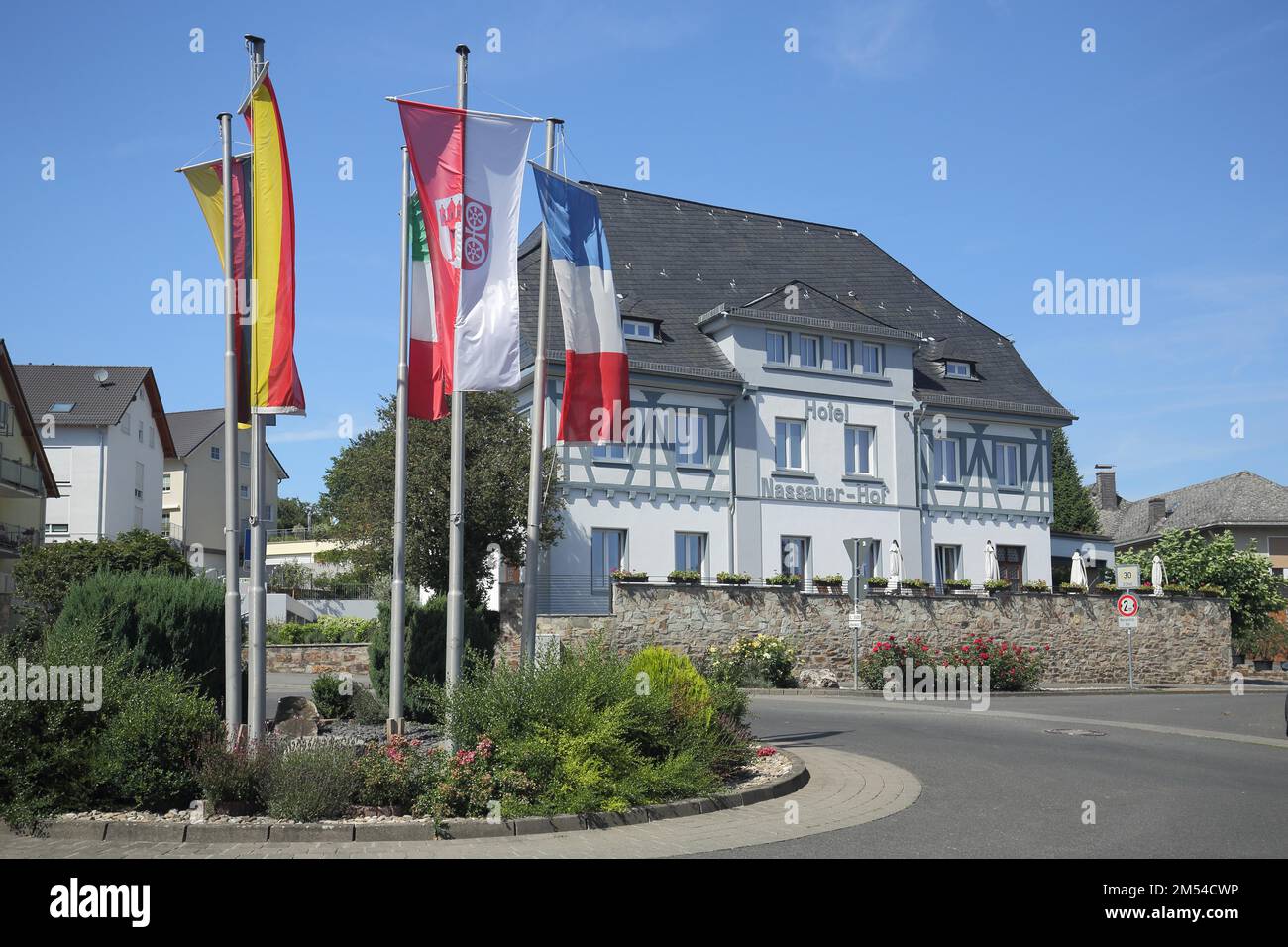 Hotel Restaurant Nassauer Hof with flags at the roundabout, Kiedrich ...