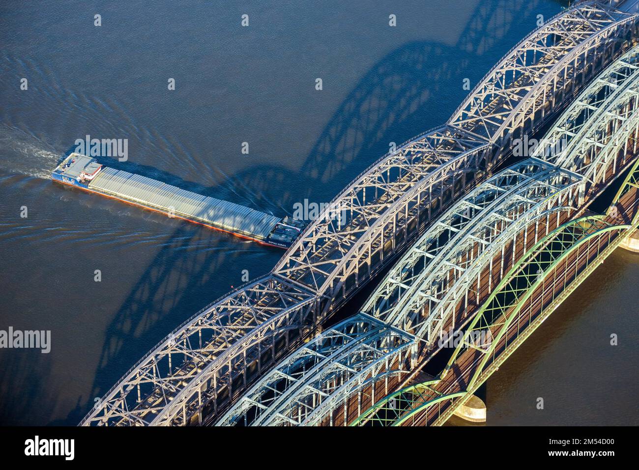 Aerial view of a barge under the Hamburg Elbe bridge, transport ...