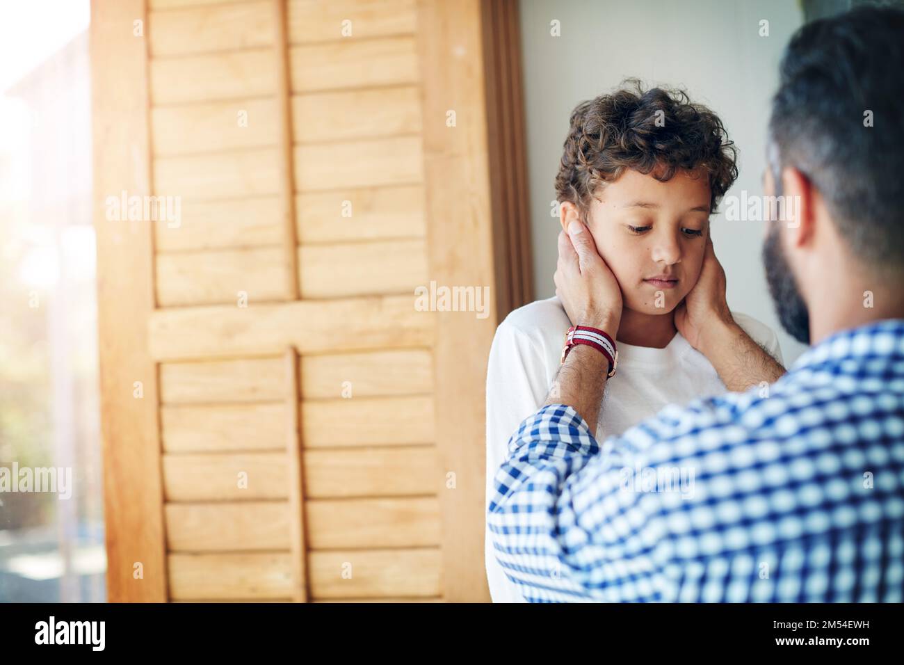 Tell me how I can help to cheer you up...a sad little boy being ...