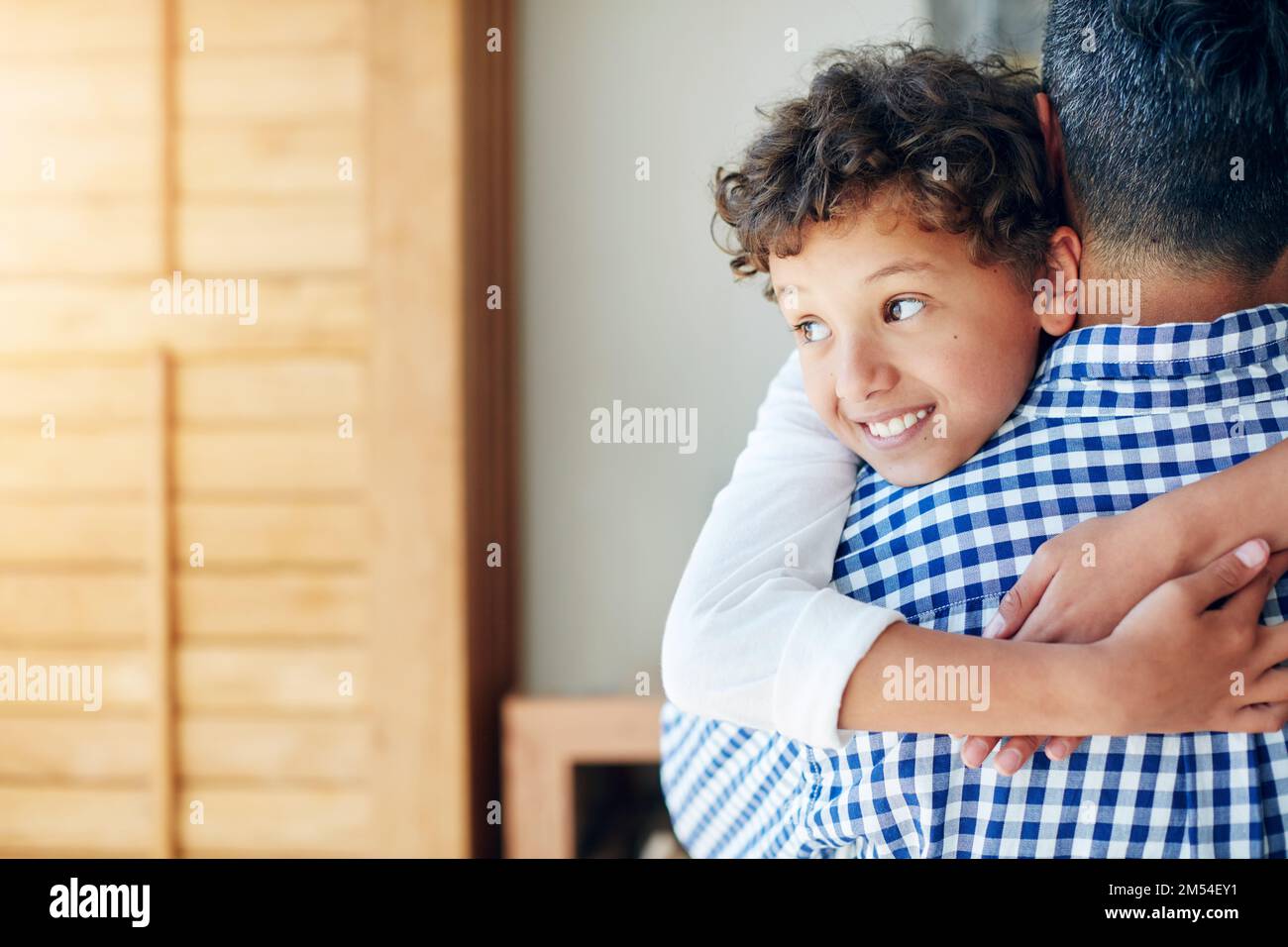 He shares a very special bond with his Dad. a little boy hugging his ...