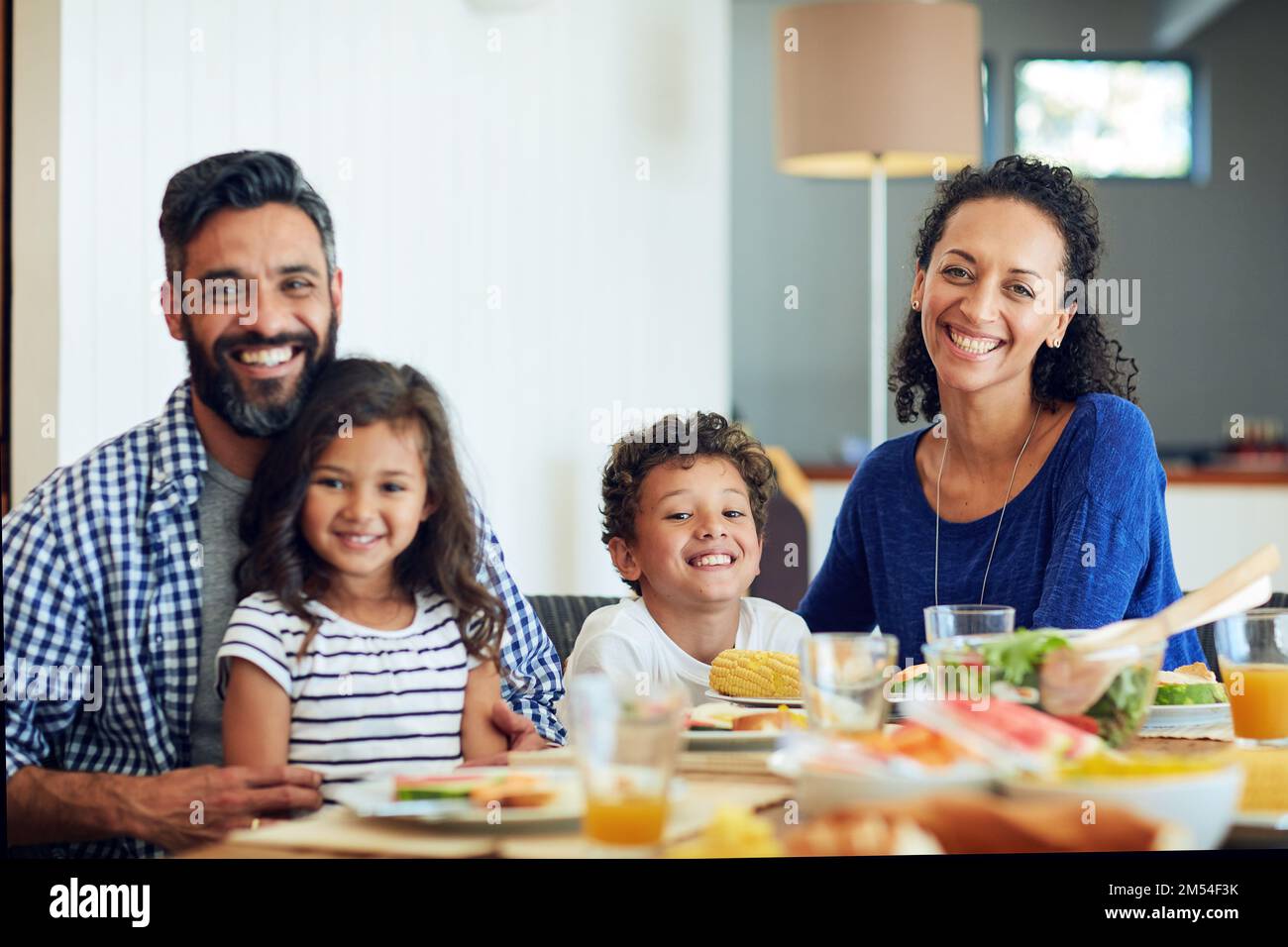 Building family bonds around the table. Portrait of a happy family ...