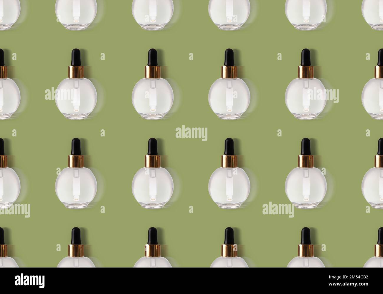Many bottles of essential oil on color background. Pattern for design ...