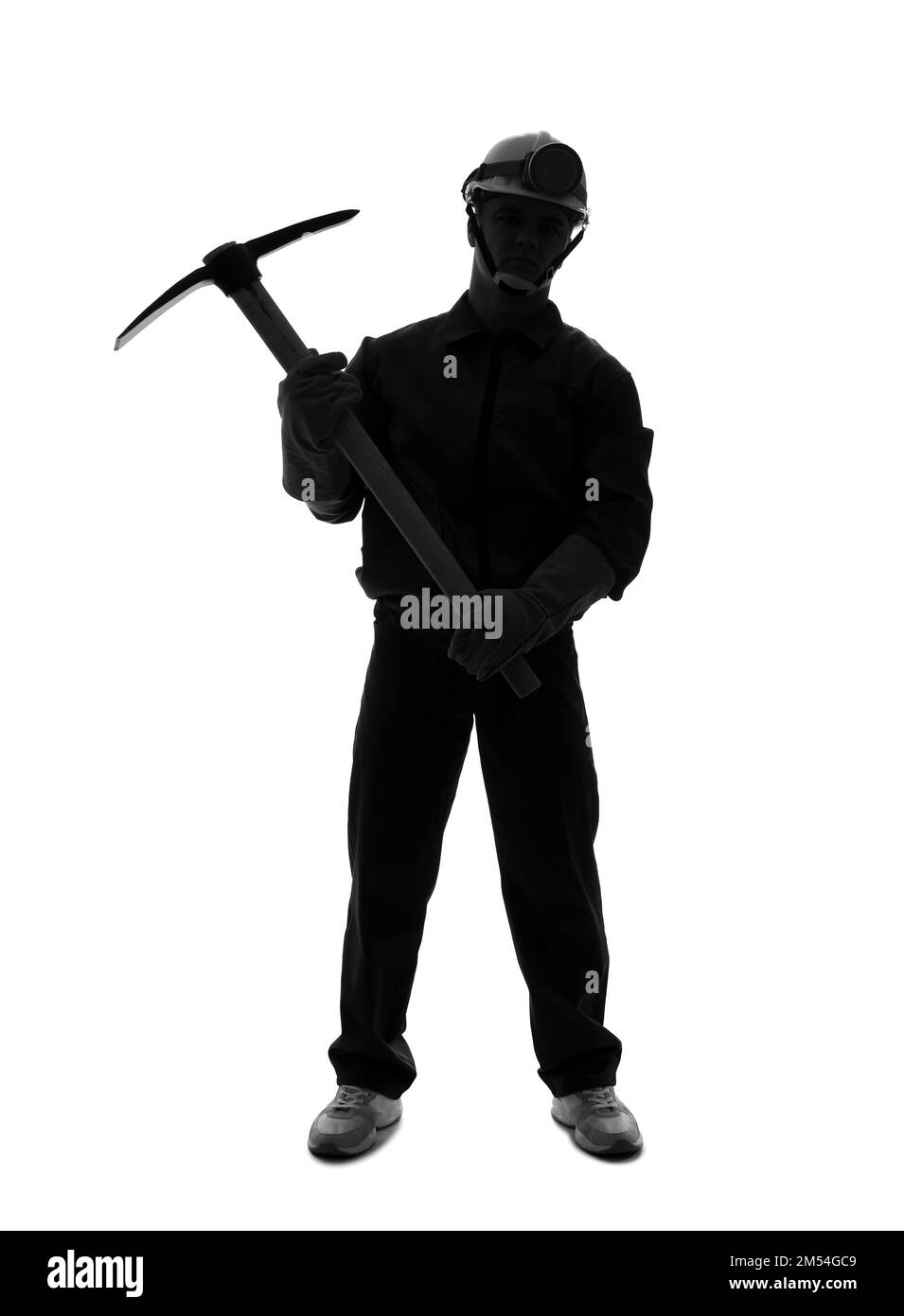 Silhouette of male miner with pick on white background Stock Photo - Alamy