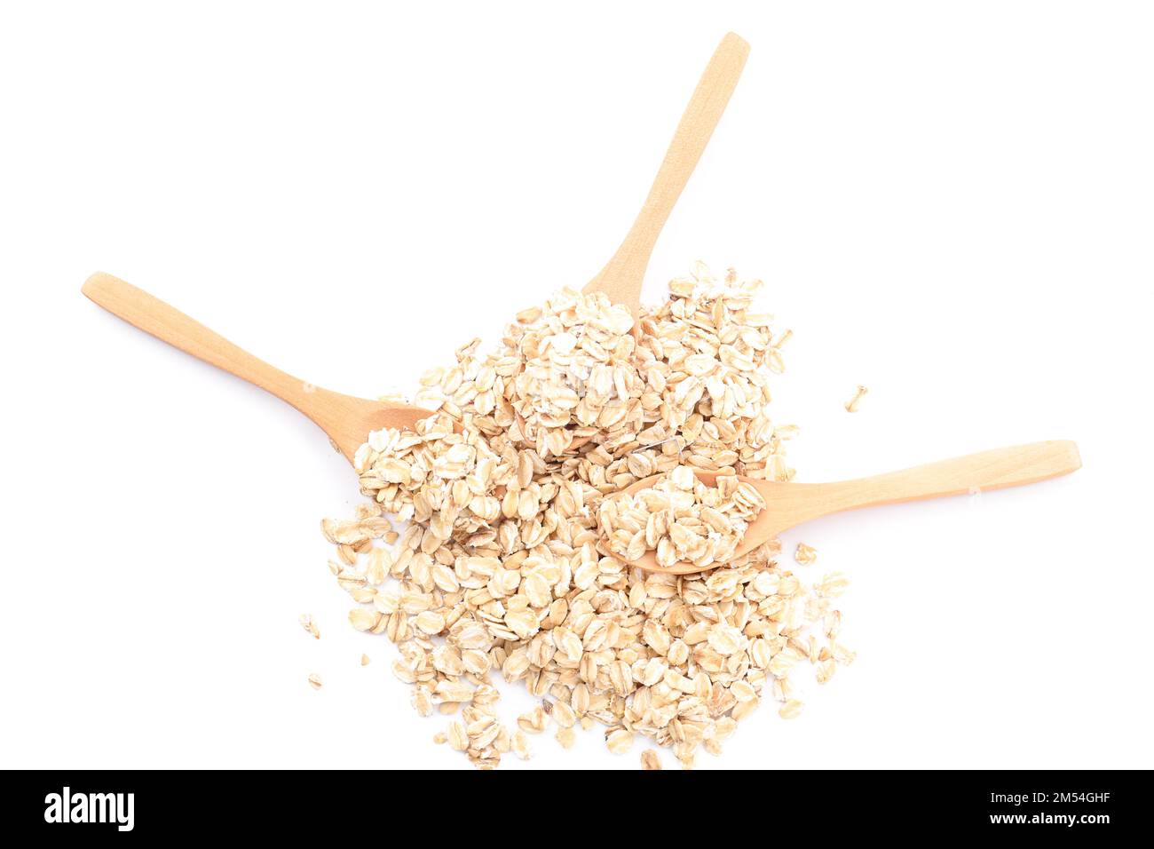 Wooden spoons with raw oatmeal isolated on white background Stock Photo ...
