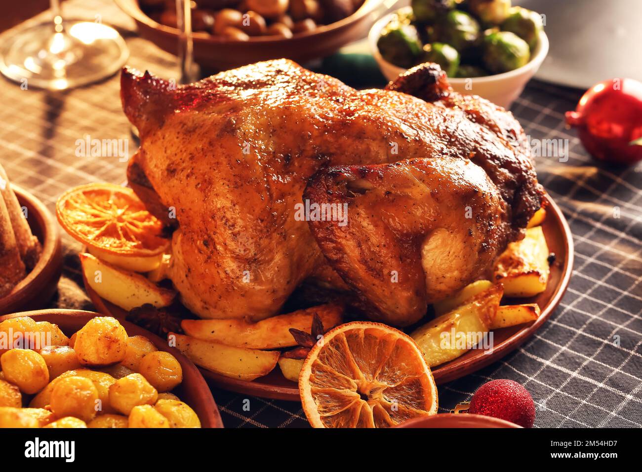 Plate with tasty chicken and potato on Christmas dining table in room ...