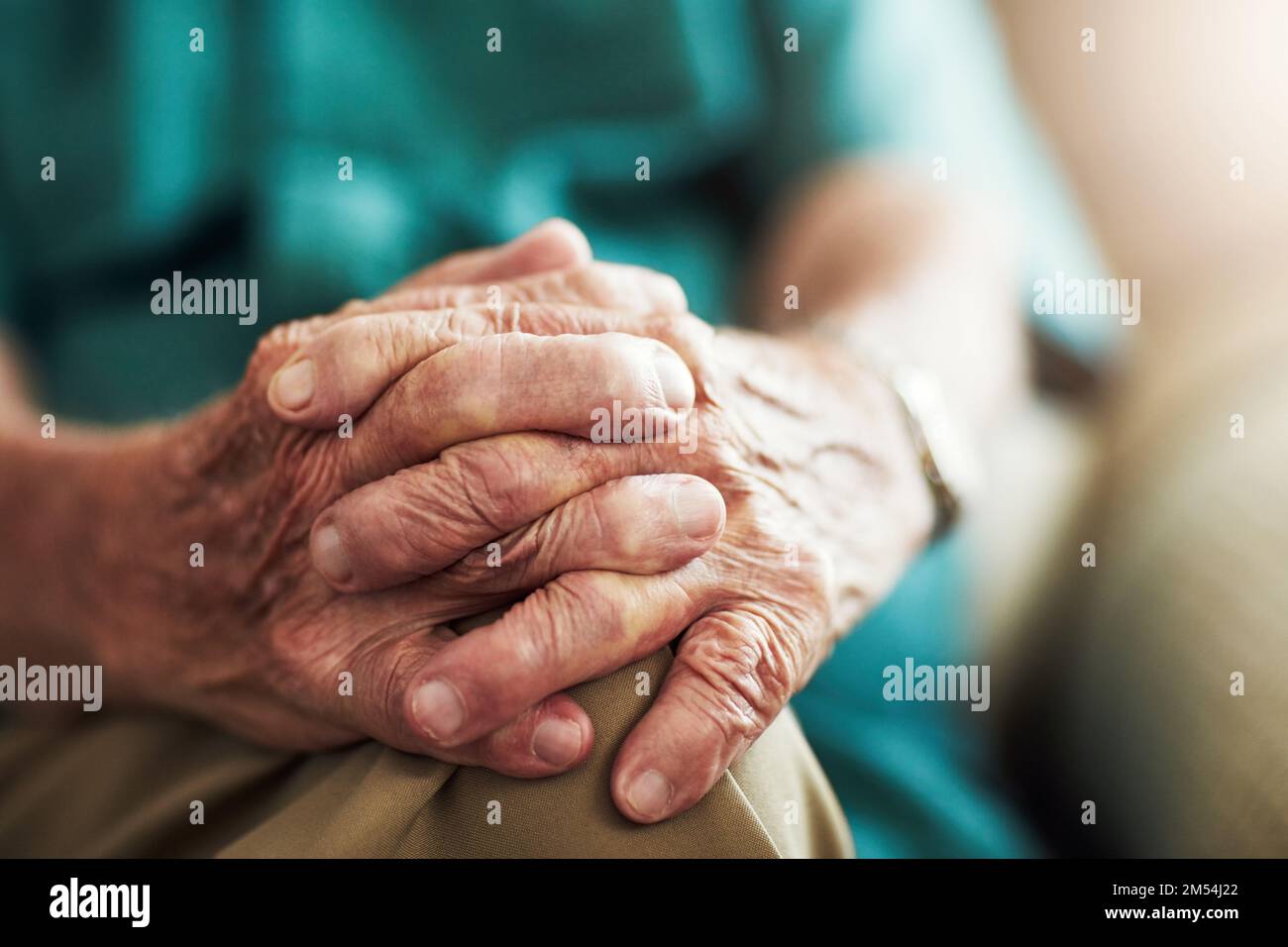 Hands really do tell a story. an unrecognizable senior male sitting ...