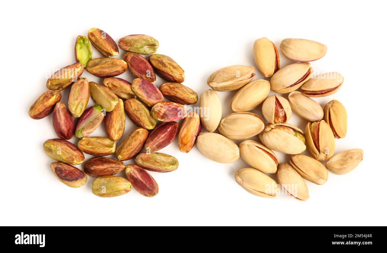 Unpeeled and peeled pistachio nuts isolated on white background Stock ...