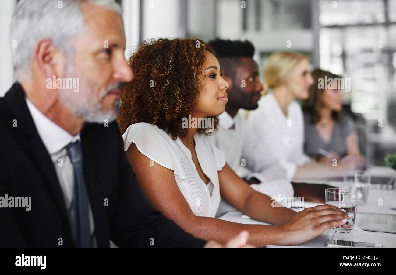 Building a high-performance team. a group of businesspeople sitting in ...