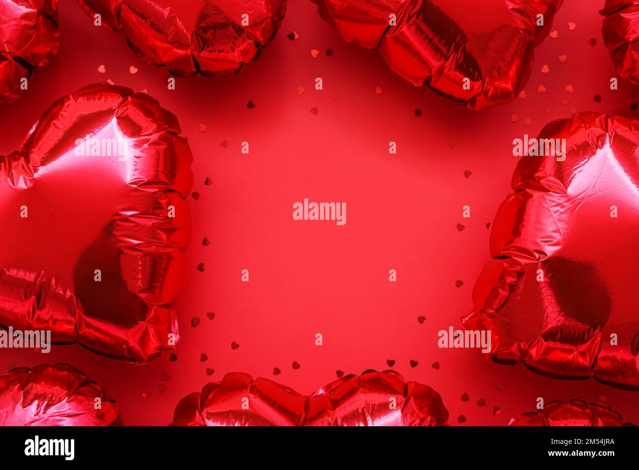 Frame made of heart-shaped balloons on red background. Valentine's Day ...