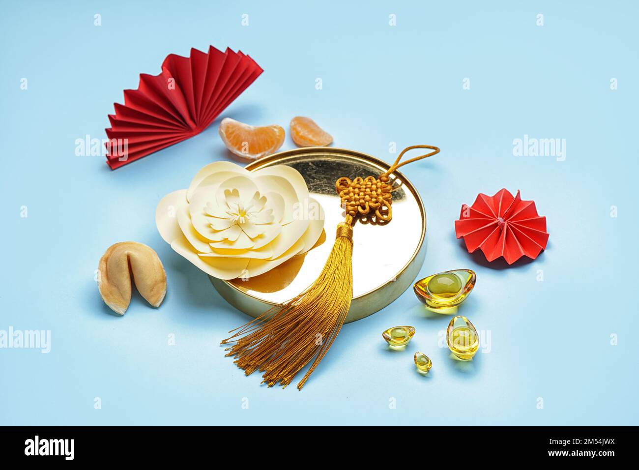 Chinese symbols with mirror, mandarins and fortune cookie on blue ...