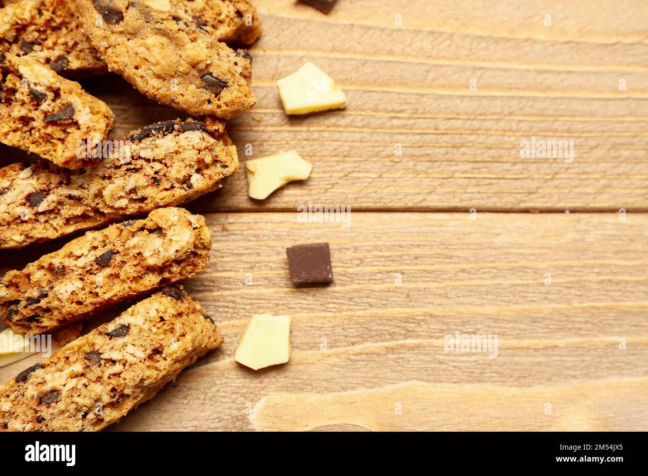 Tasty biscotti cookies and chocolate on wooden background Stock Photo ...