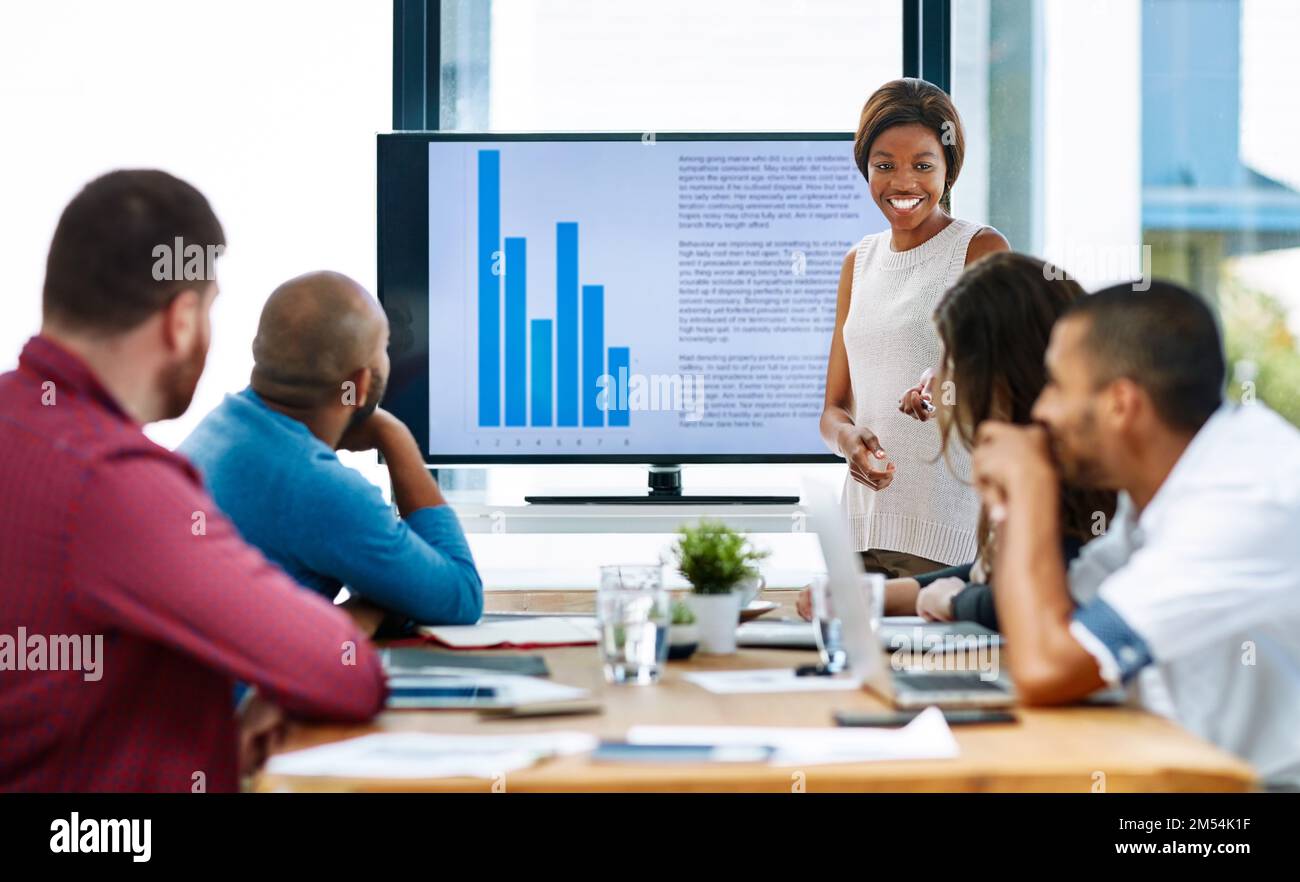 Everyone with me. a young female designer giving a presentation in the ...