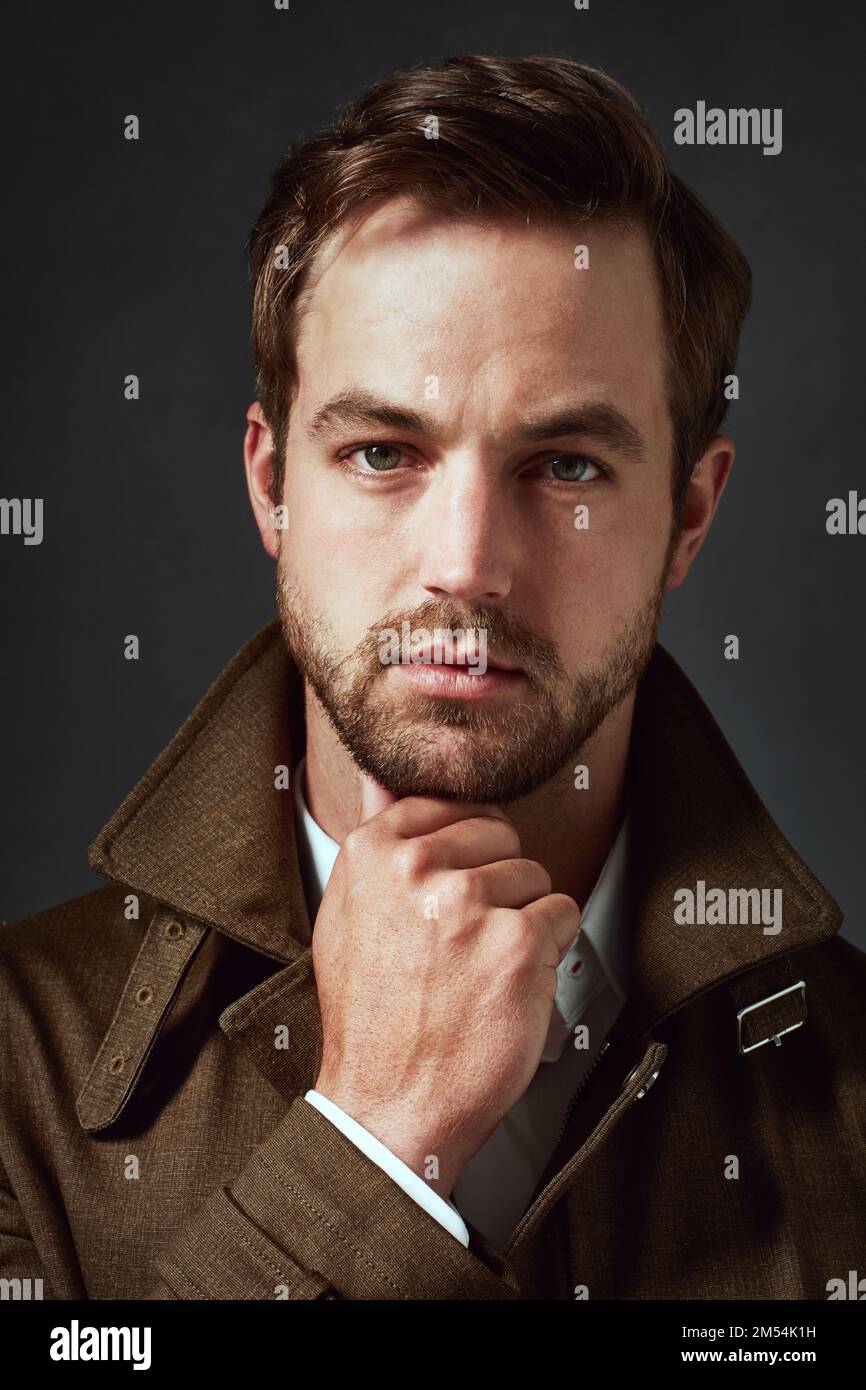 All man, all style. Studio portrait of a handsome young man posing ...