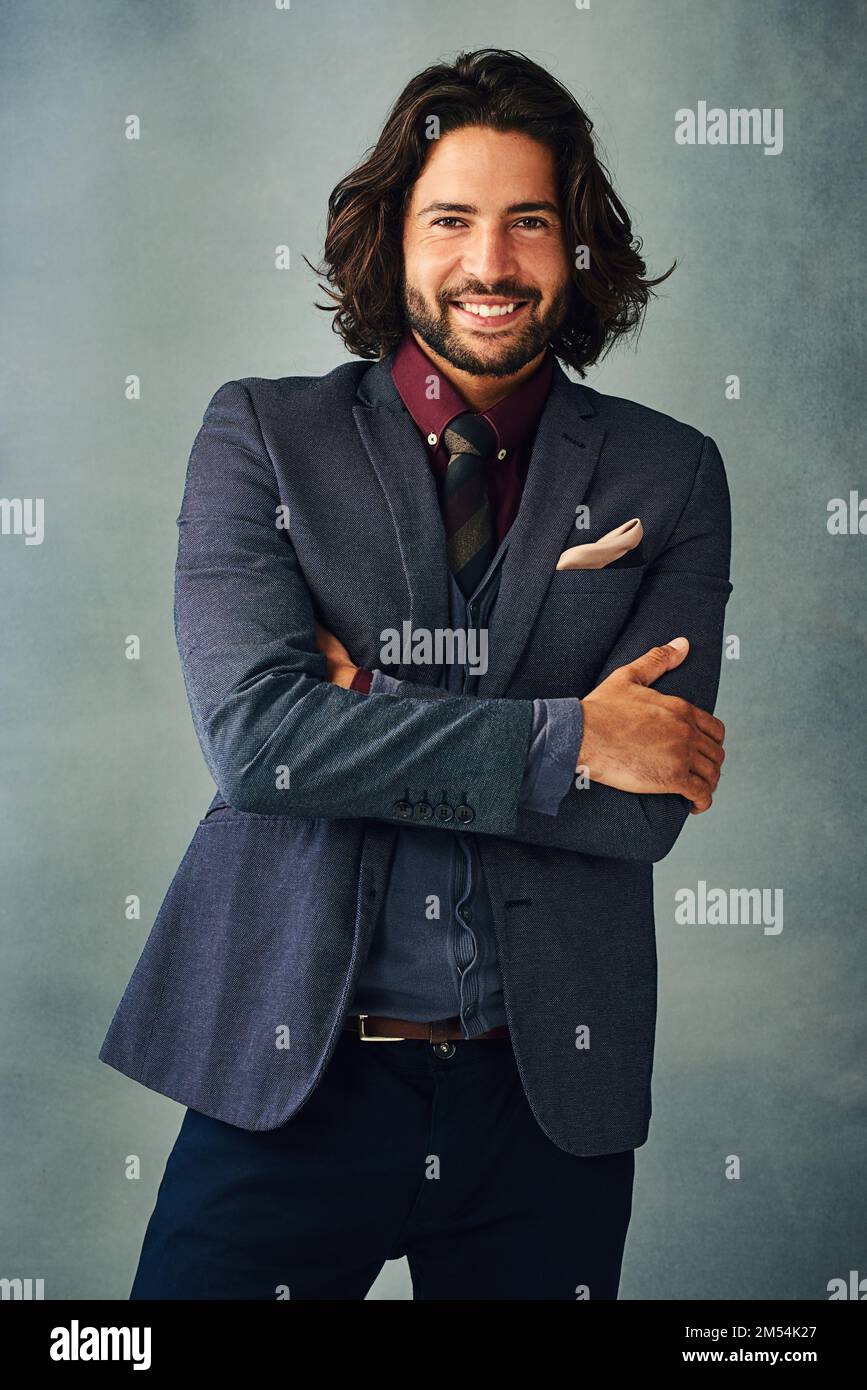 Hes cool and sophisticated. Studio portrait of a stylishly dressed ...