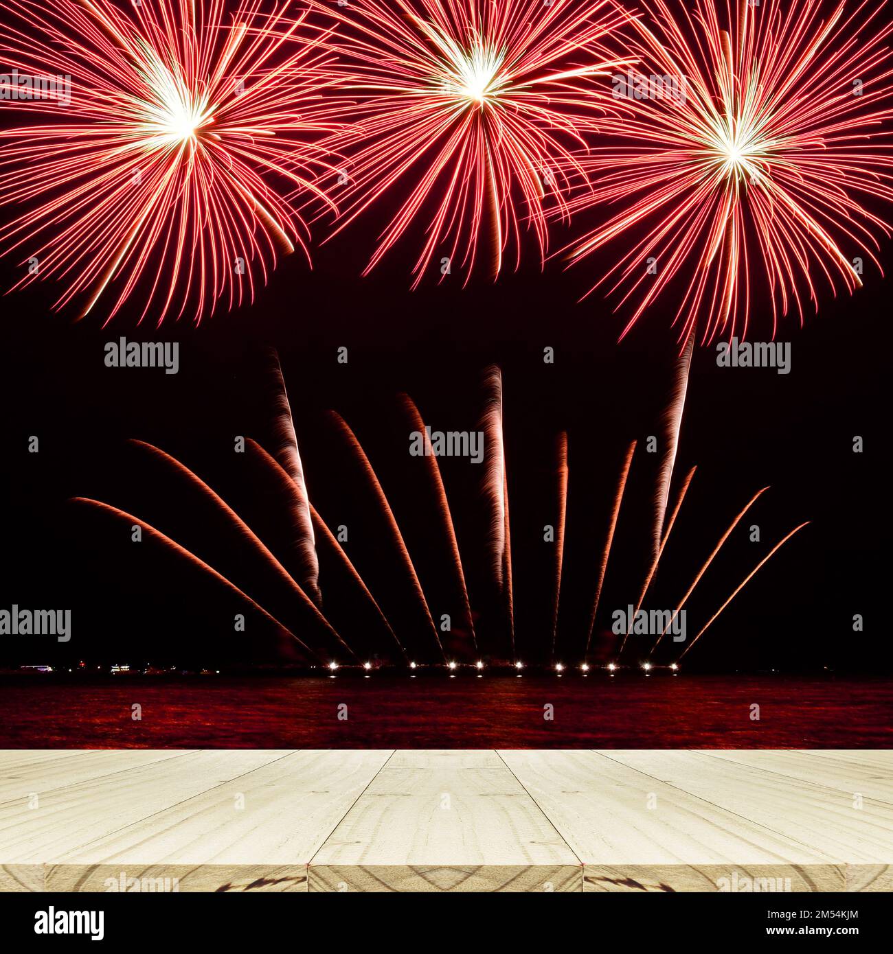 Background of wood table with fireworks backdrop for products display ...