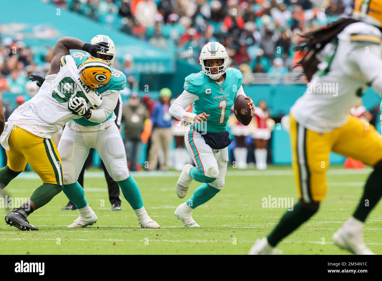 Miami. FL USA; Miami Dolphins quarterback Tua Tagovailoa (1) scrambles ...