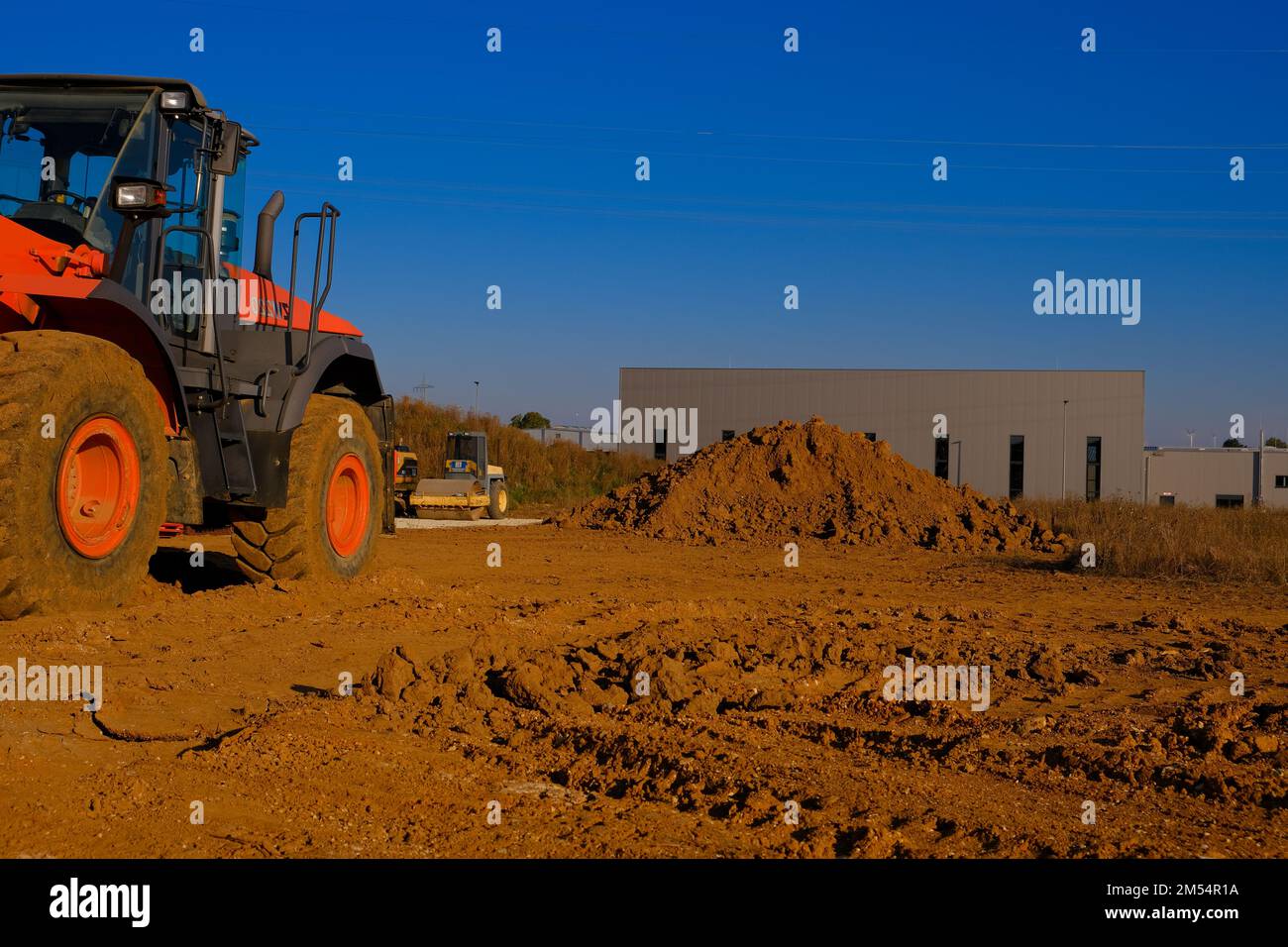 Construction tractor with bucket close-up in sand .Excavator at ...
