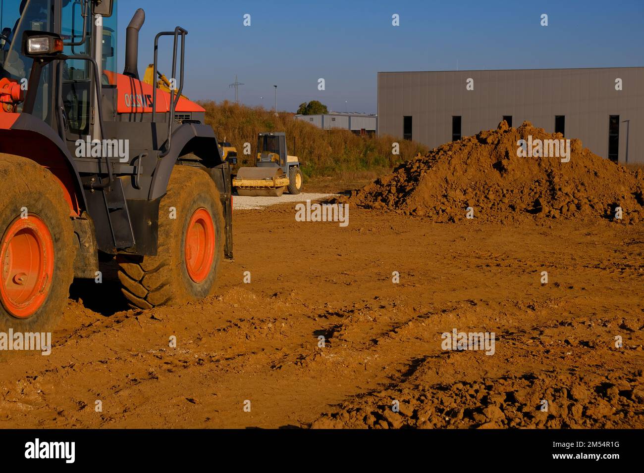 Construction tractor with bucket close-up in sand and clay.Excavator at ...