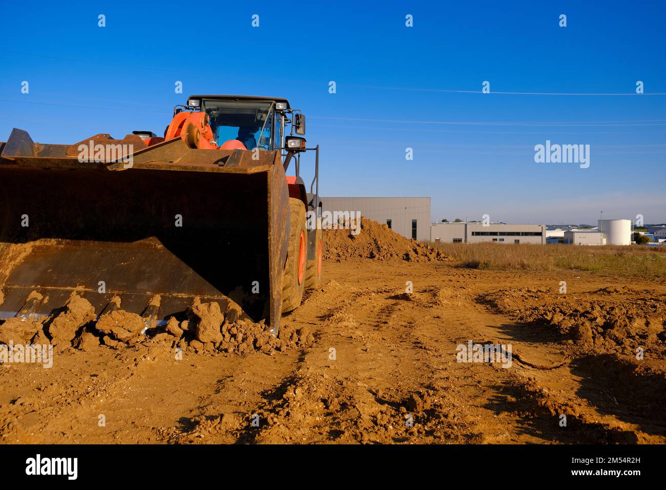 tractor with bucket in sand and clay.Excavator at construction site on ...