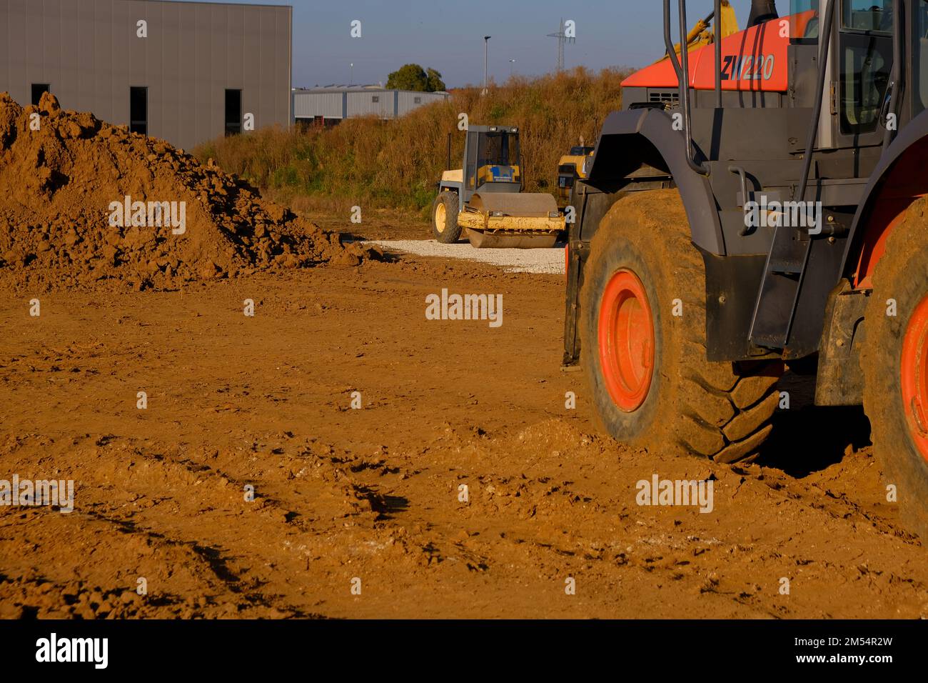 Construction tractor with bucket close-up in sand and clay.Excavator on ...
