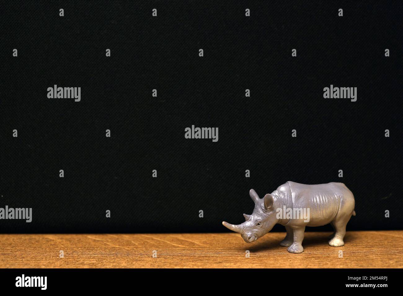 Group of jungle animals toys isolated over black background. Plastic ...