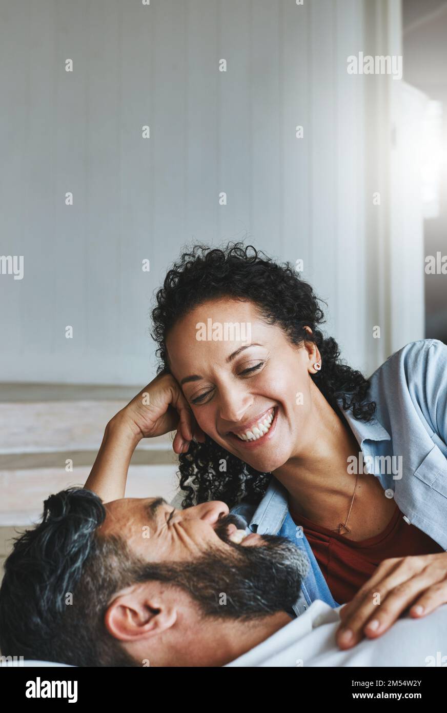 You can always make me laugh. a relaxed couple enjoying the day at home ...