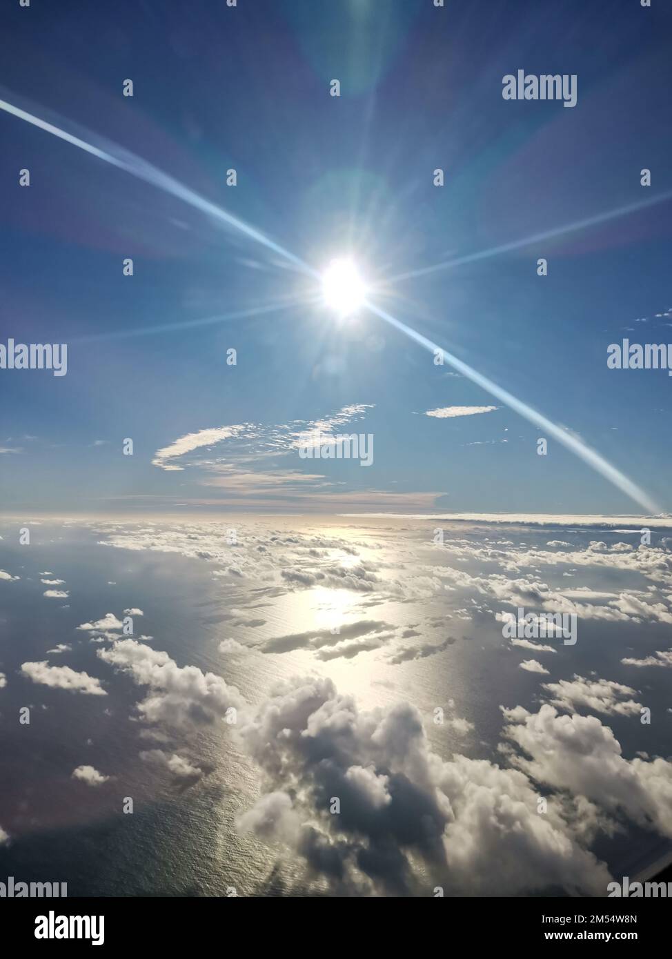 Shining sun with glare on background of horizon. Natural background ...