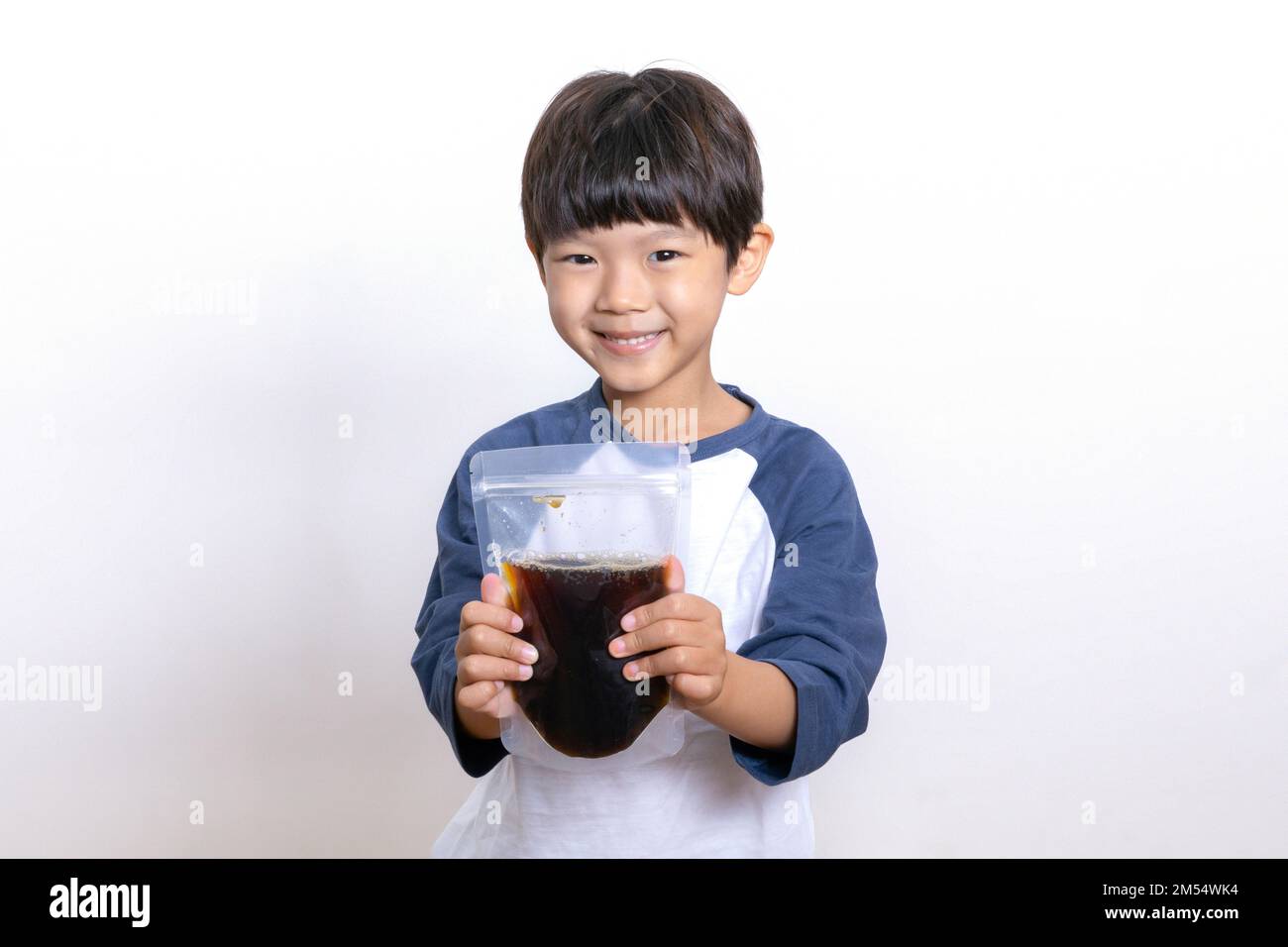 Asian Korean child holding oriental medicine Stock Photo - Alamy