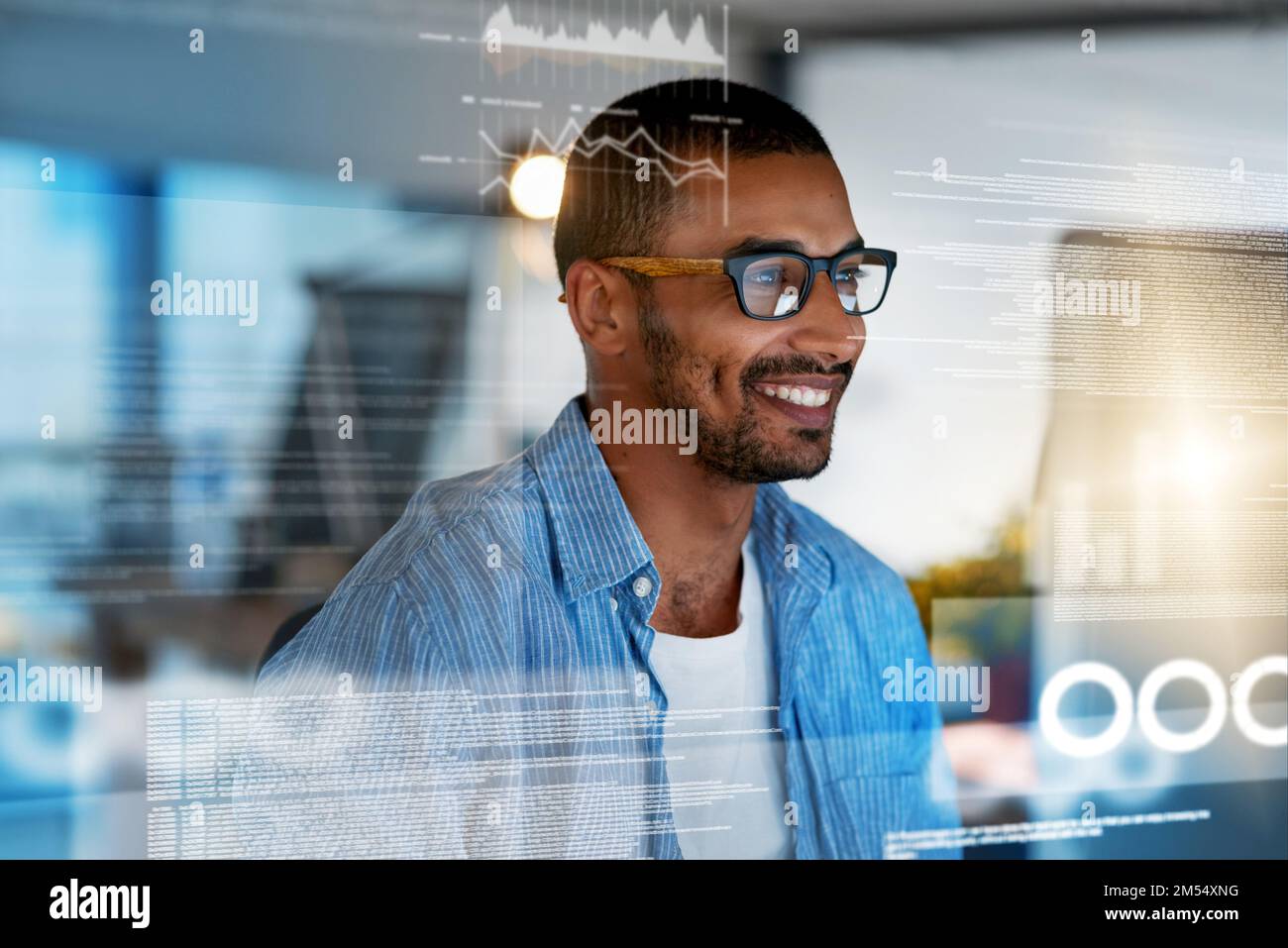 Almost done debugging. a happy computer programmer working on new software at his computer Stock ...