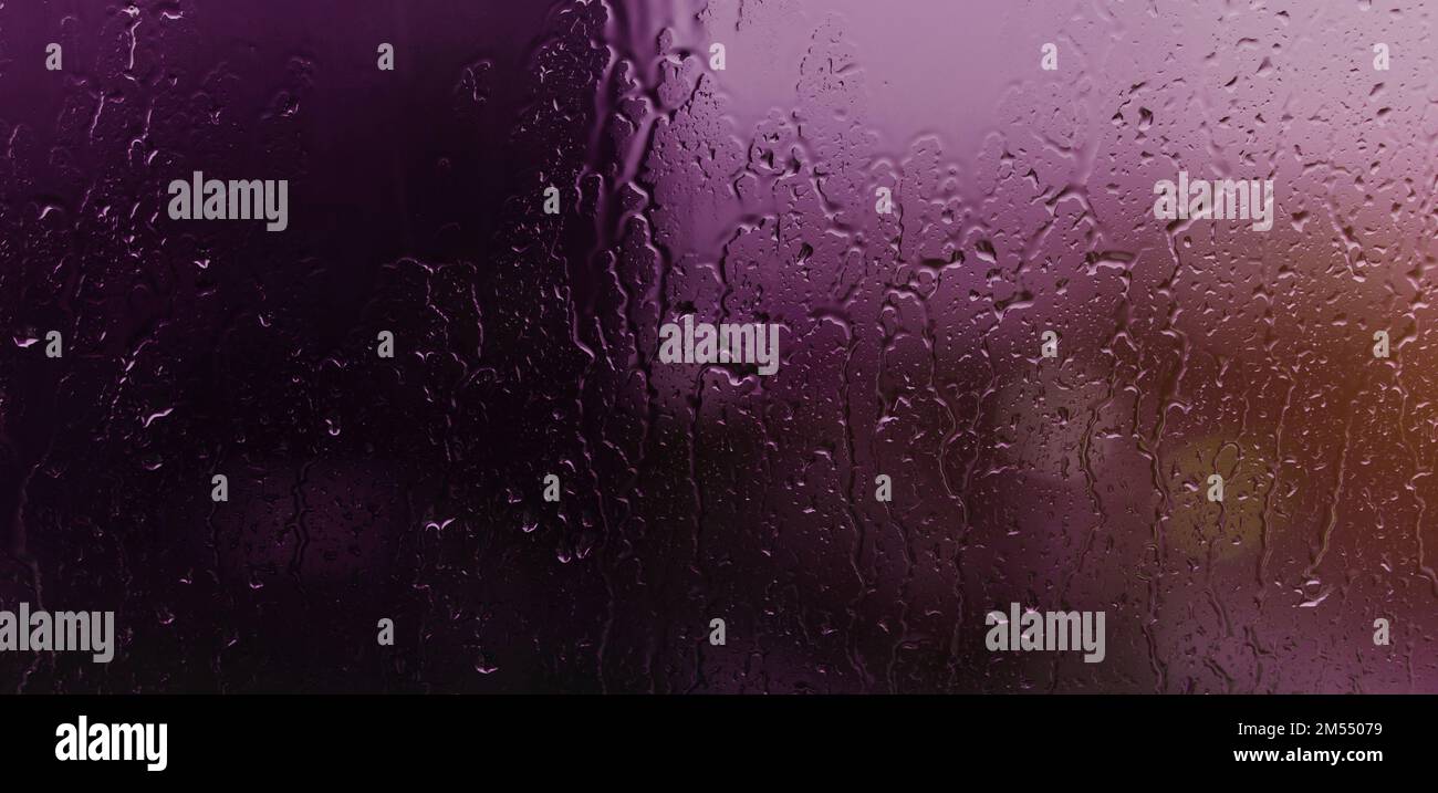 Rainy season, Rain drops on window's glass on a dark weather day ...