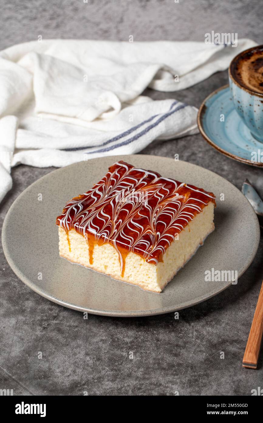 Trilece cake slice on dark background. Milk and caramel cake. Bakery ...