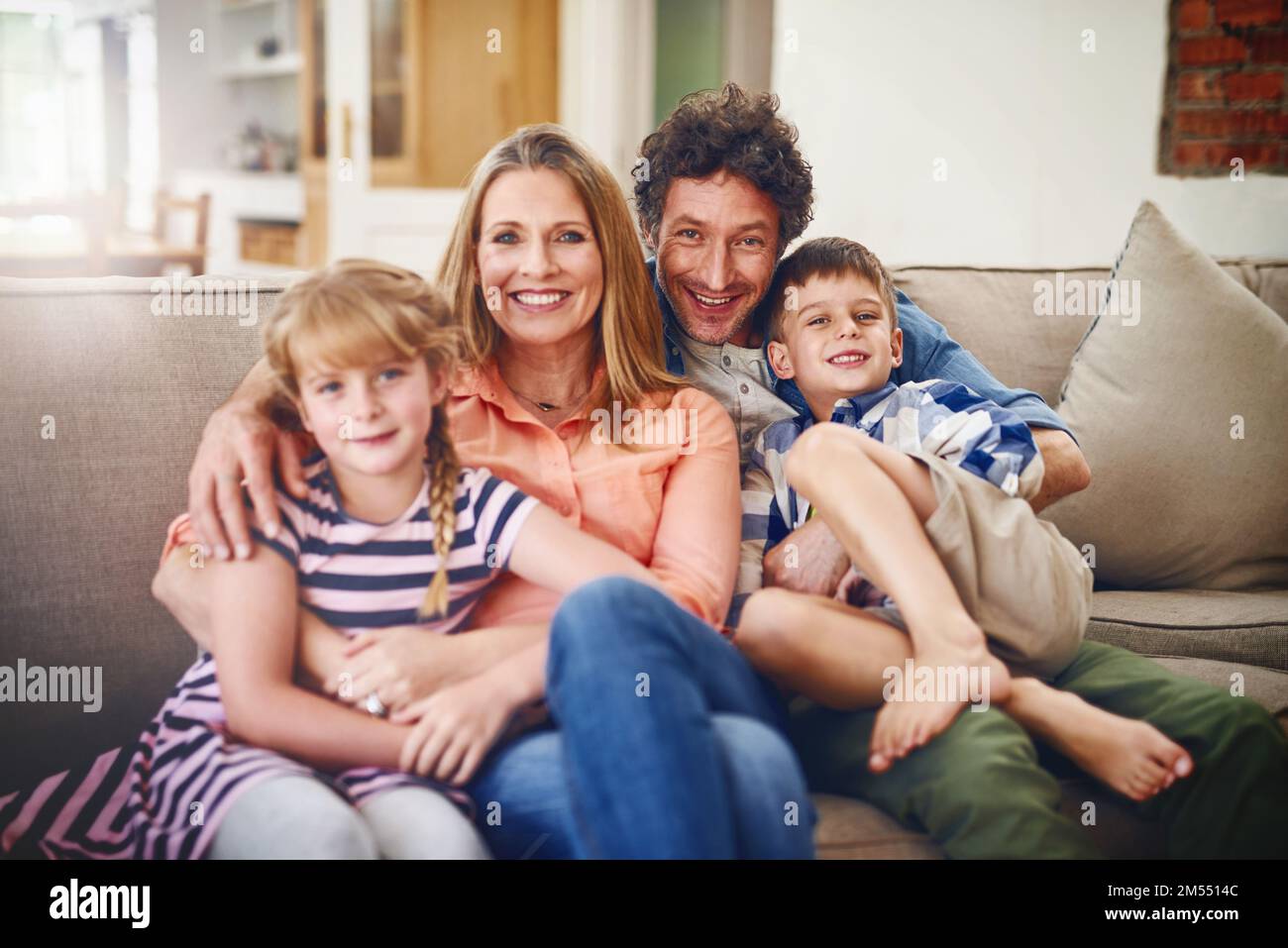 The love of a family. Portrait of a happy family bonding together at ...
