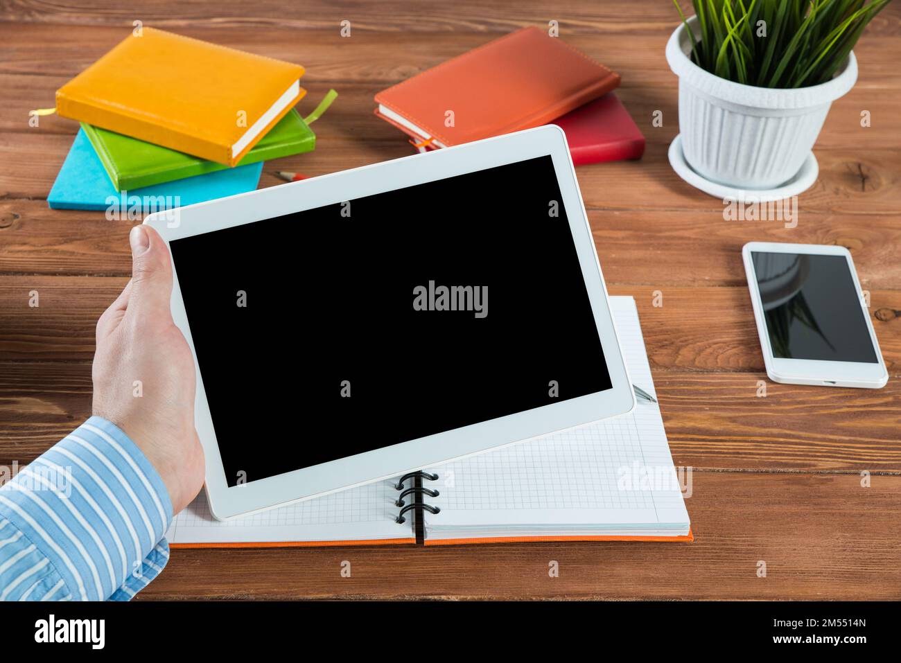 businessman with a tablet, works in the office Stock Photo - Alamy